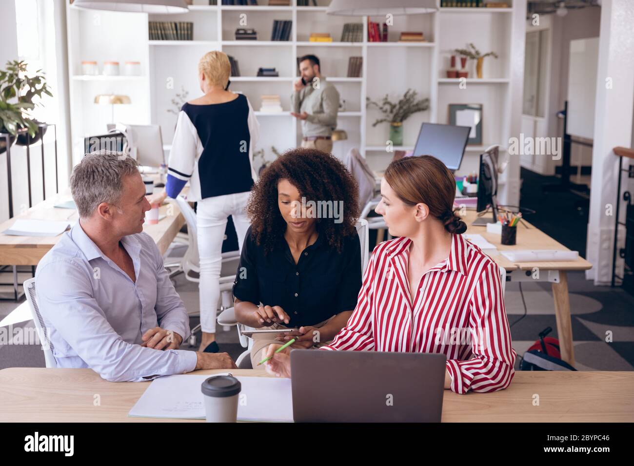 Multi races businesspeople working together Stock Photo - Alamy