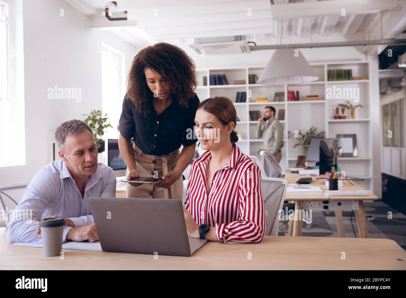 Multi races businesspeople working together Stock Photo - Alamy