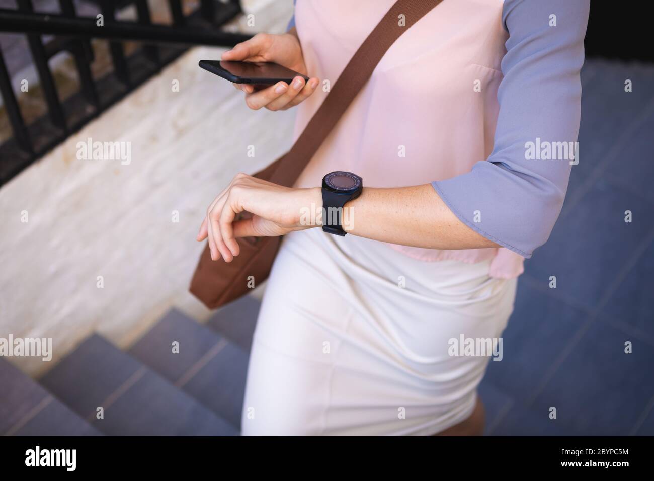 Adult woman checking smartphone hi-res stock photography and images - Alamy