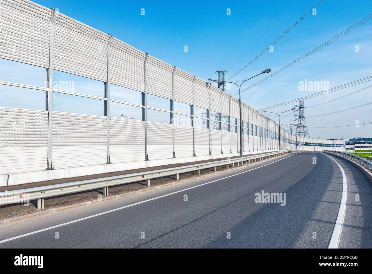 New modern highway with noise protection fence along it Stock Photo - Alamy