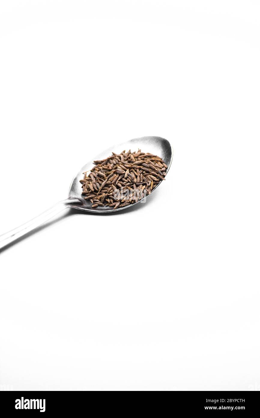 Cumin seeds isolated on white background Stock Photo - Alamy