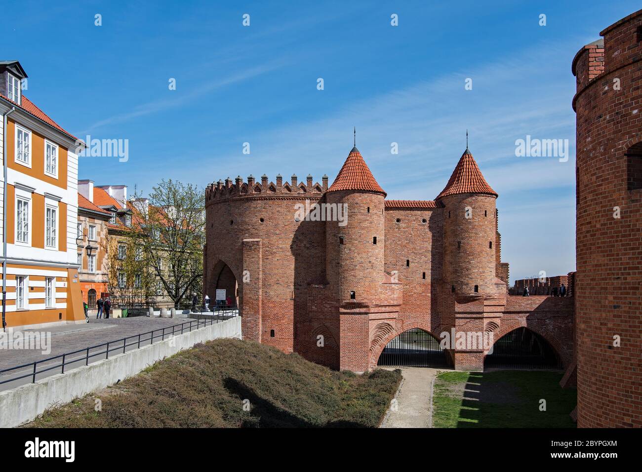 Warsaw Barbican fort and the old town Stock Photo - Alamy
