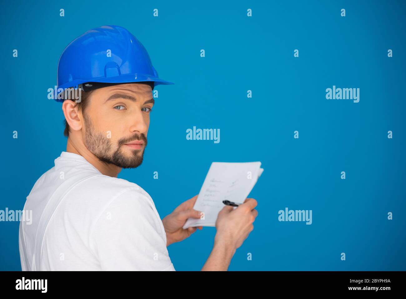 Artisan or workman taking notes Stock Photo - Alamy