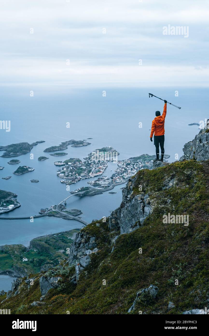 Hiker on rocky trail walking on mountain ridge. Concept vision. On top ...
