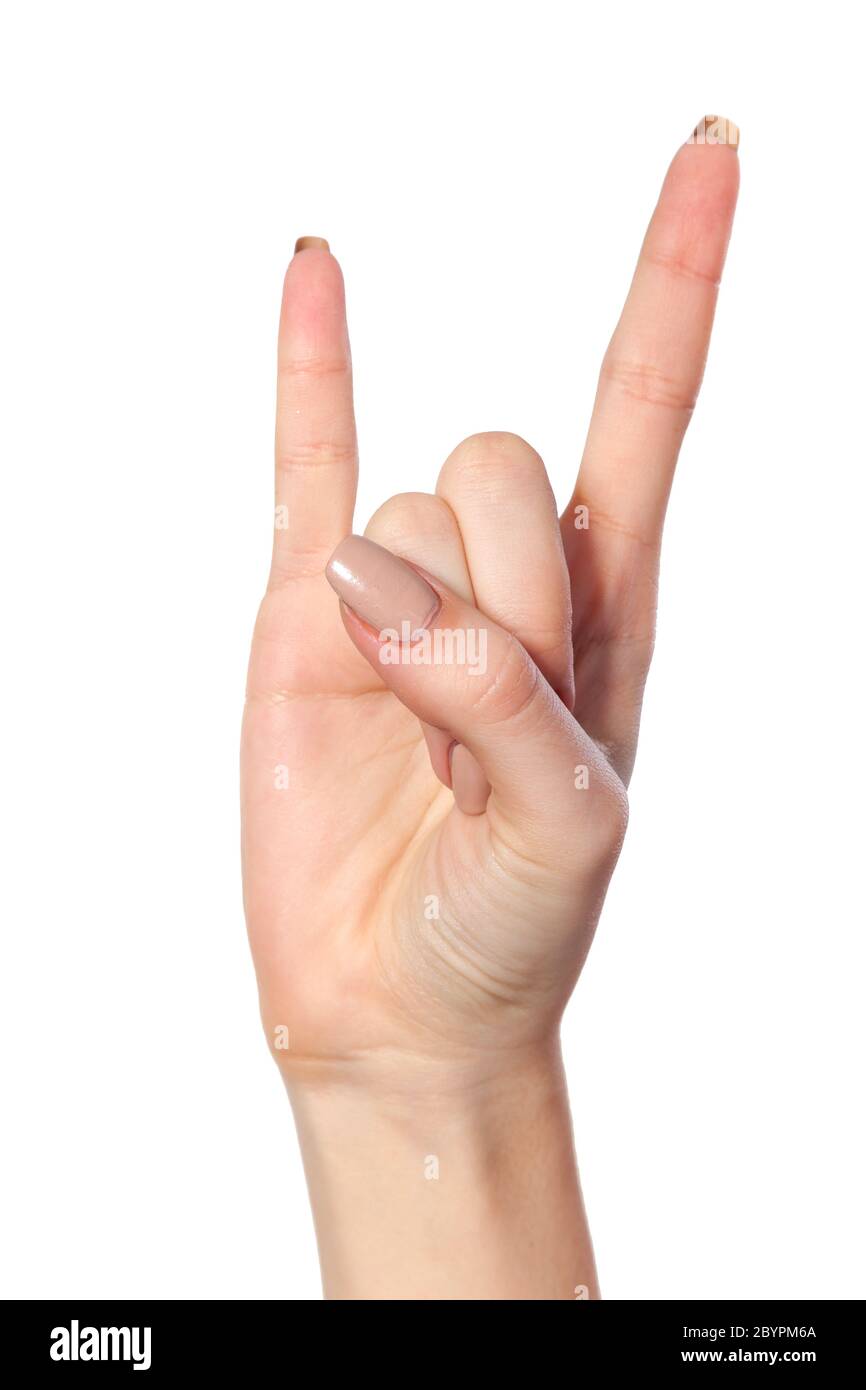 A woman's hand giving the Rock and Roll sign Stock Photo - Alamy