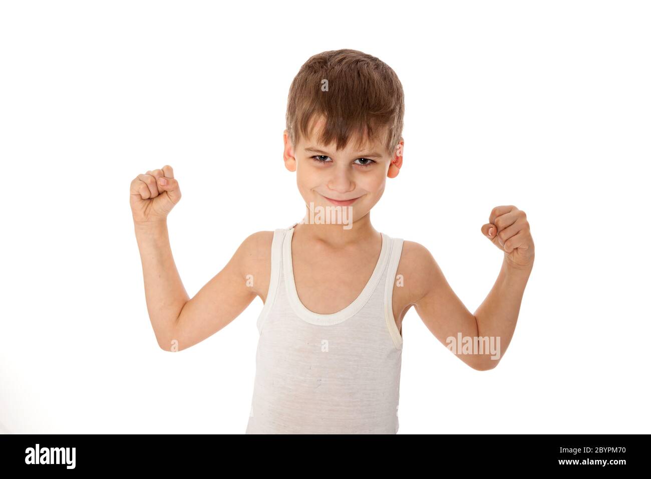 Boy showing his muscle Stock Photo - Alamy
