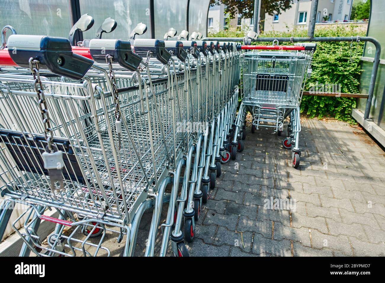 Berlin, Germany - June 10, 2020: View of a row of shopping carts in a ...