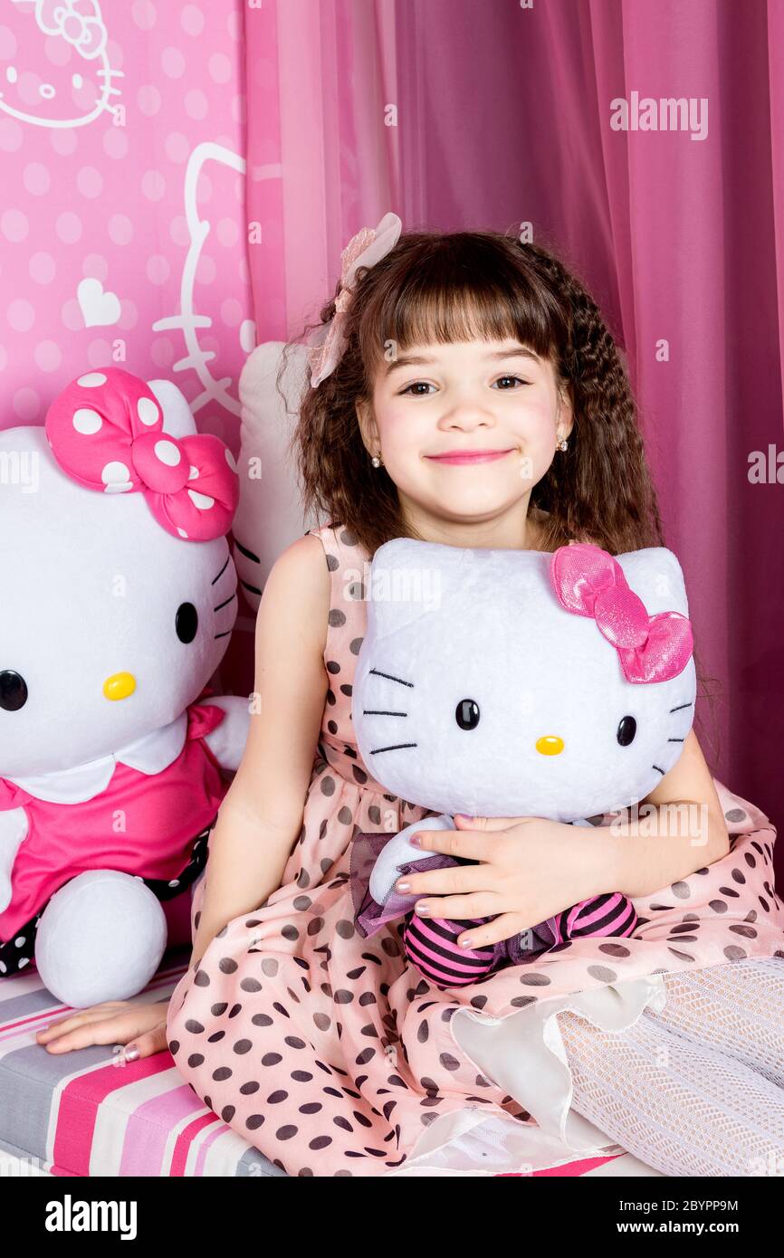 Cute little girl laying in bed Stock Photo - Alamy