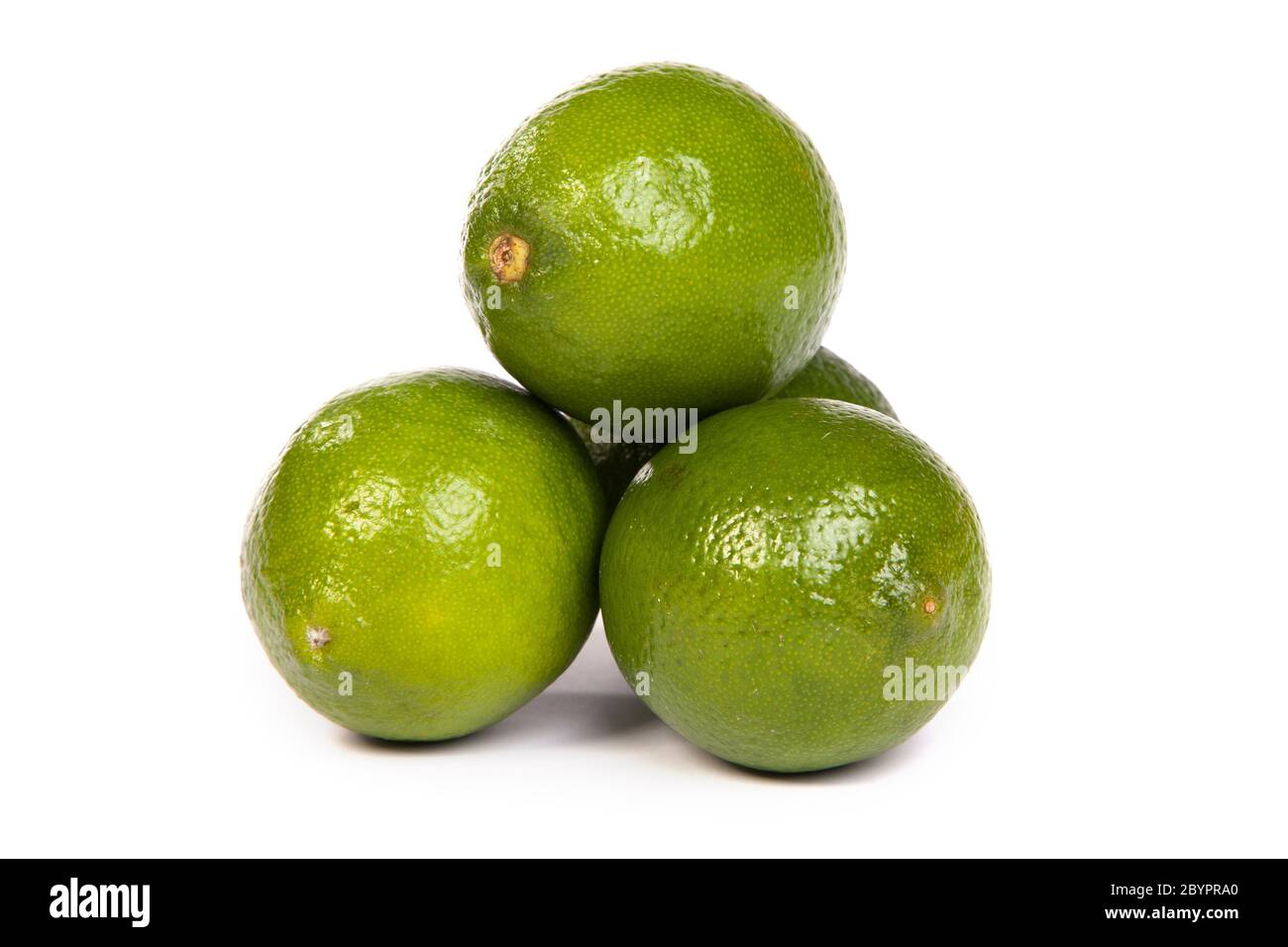 Group of whole limes and one half lime on white Stock Photo - Alamy