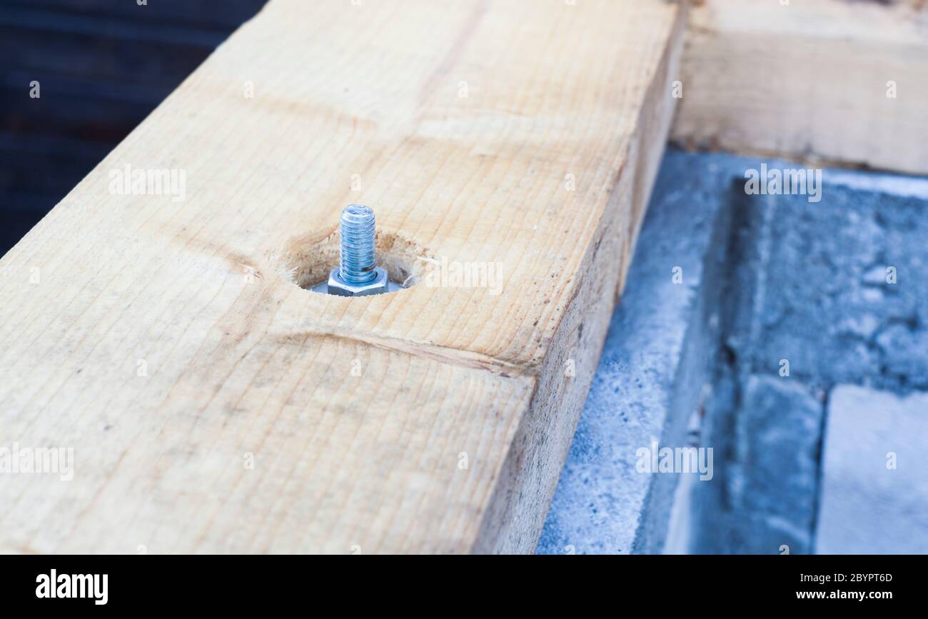 wooden beam with metal screw for construction of new house Stock Photo ...