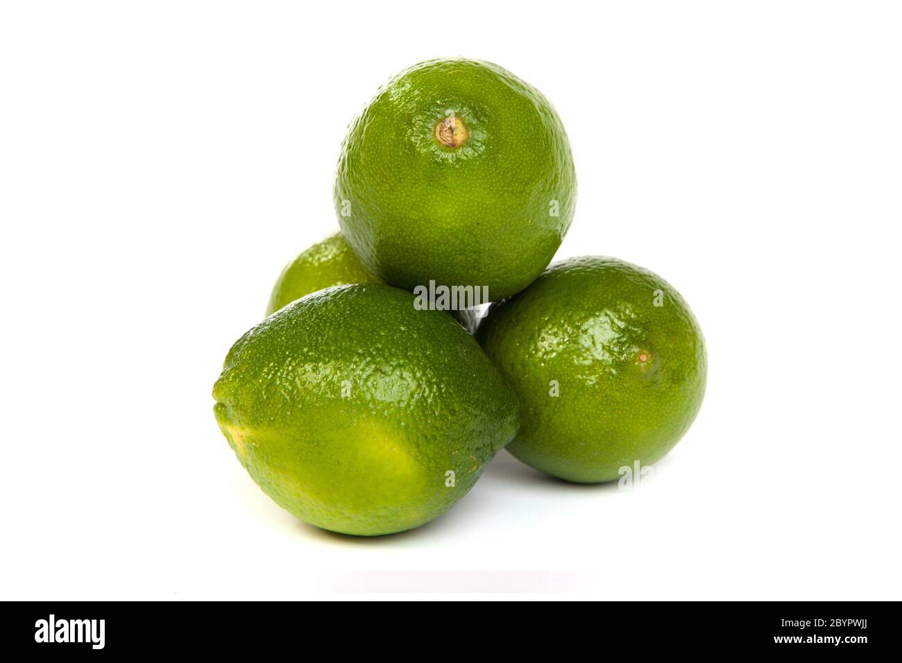 Group of whole limes and one half lime on white Stock Photo - Alamy