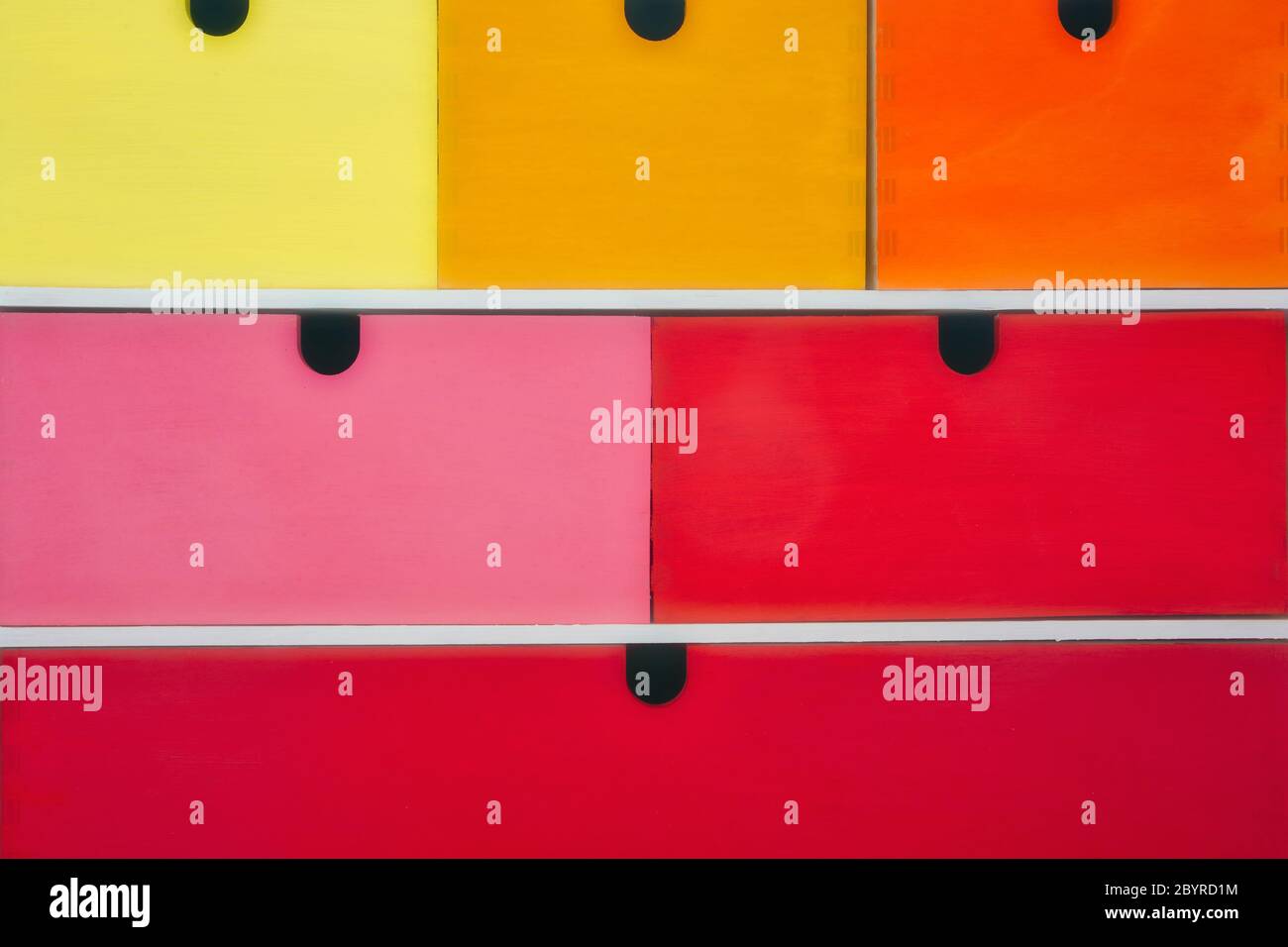 colorful wooden drawers in various colors, modern interior background ...