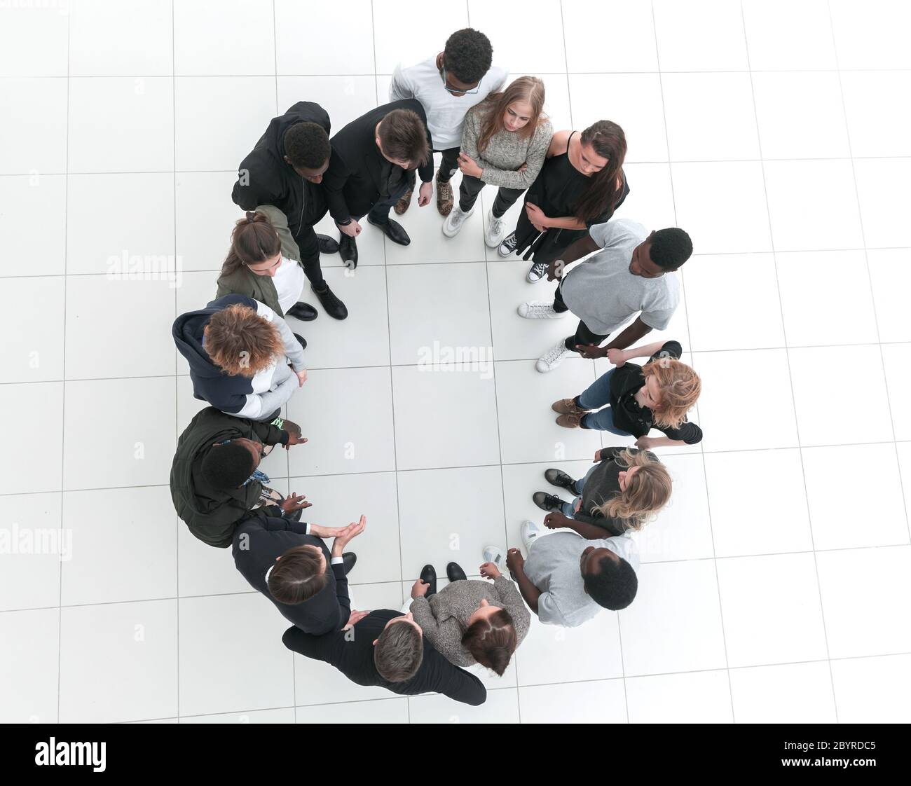 group of young successful people stands around in the office Stock ...