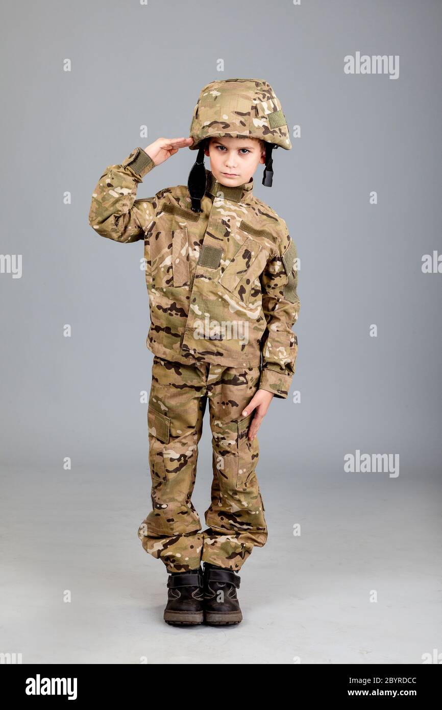 Saluting soldier. Young boy dressed like a soldier Stock Photo - Alamy