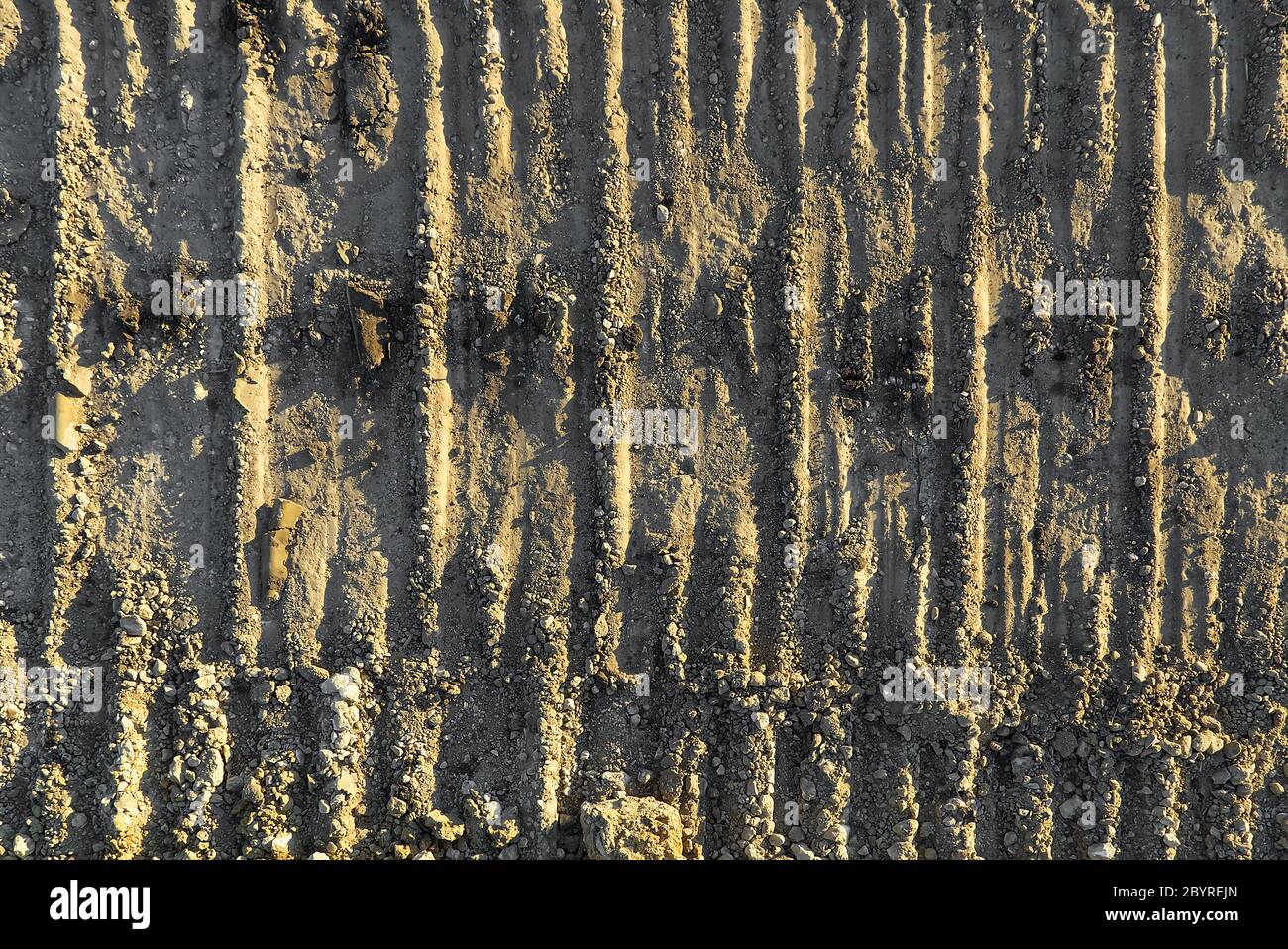 Excavator tracks on the ground texture. Mud ground earth soil trace ...