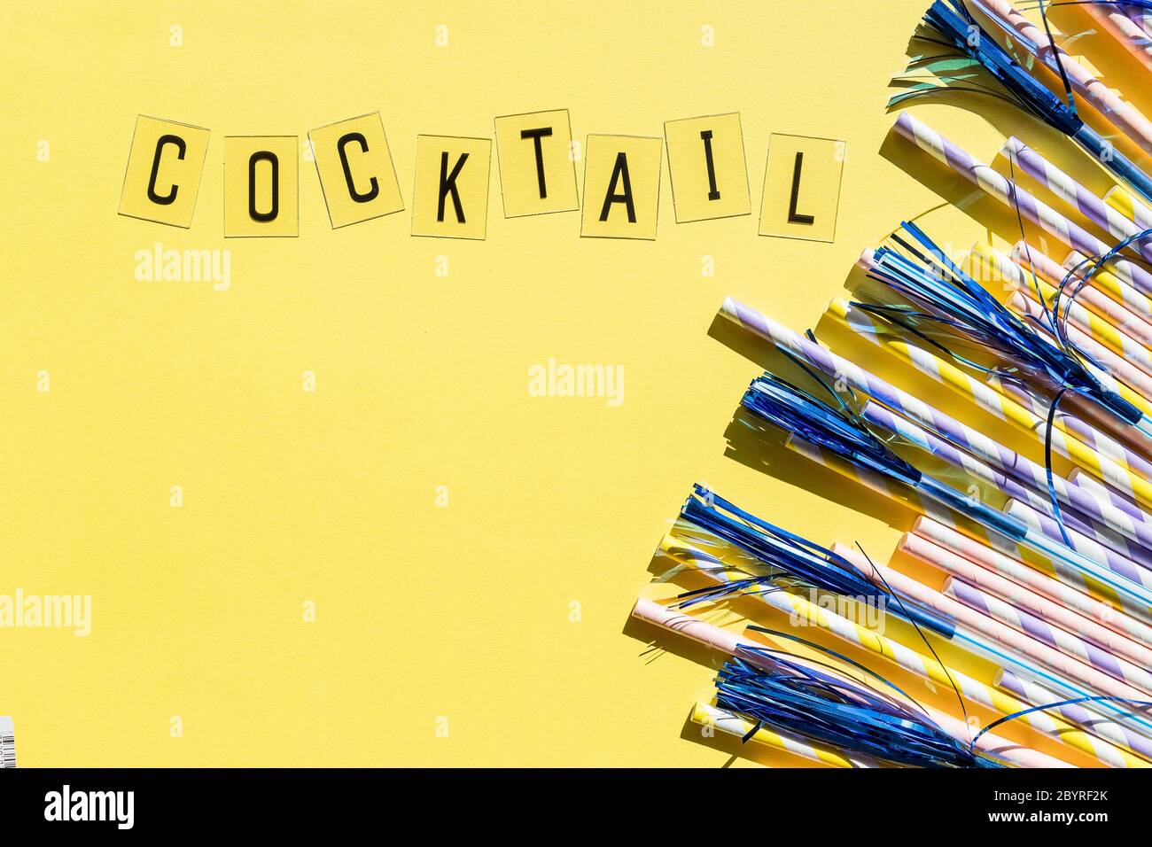 Colorful straws set,word cocktail isolated on yellow background with ...
