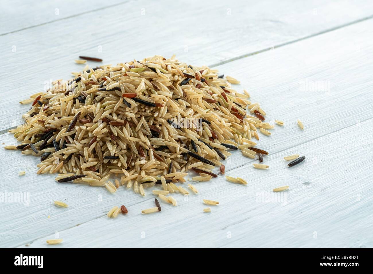 A heap of dry wild rice on light background Stock Photo - Alamy