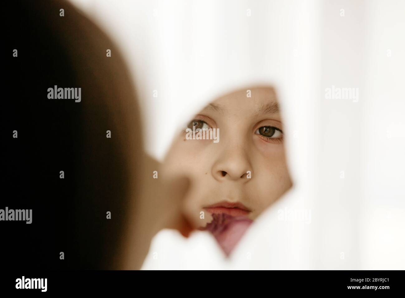 Reflection of a cute little toddler boy, child, looking in mirror ...