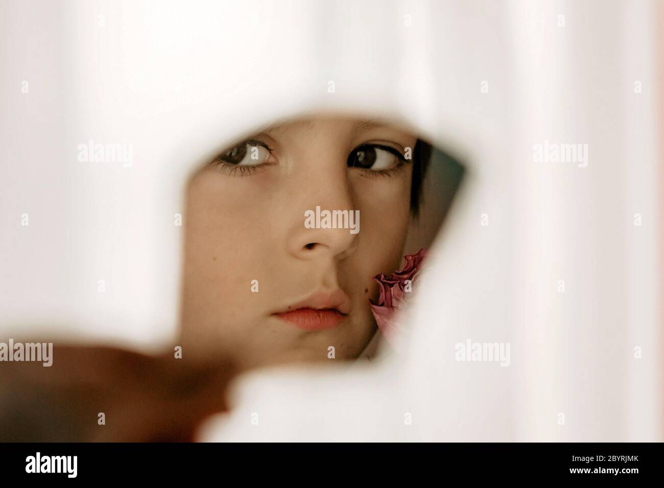Reflection of a cute little toddler boy, child, looking in mirror ...