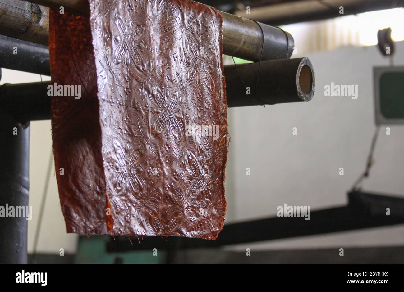 Batik textile with wax hanging in Winotosastro factory in Yogyakarta ...