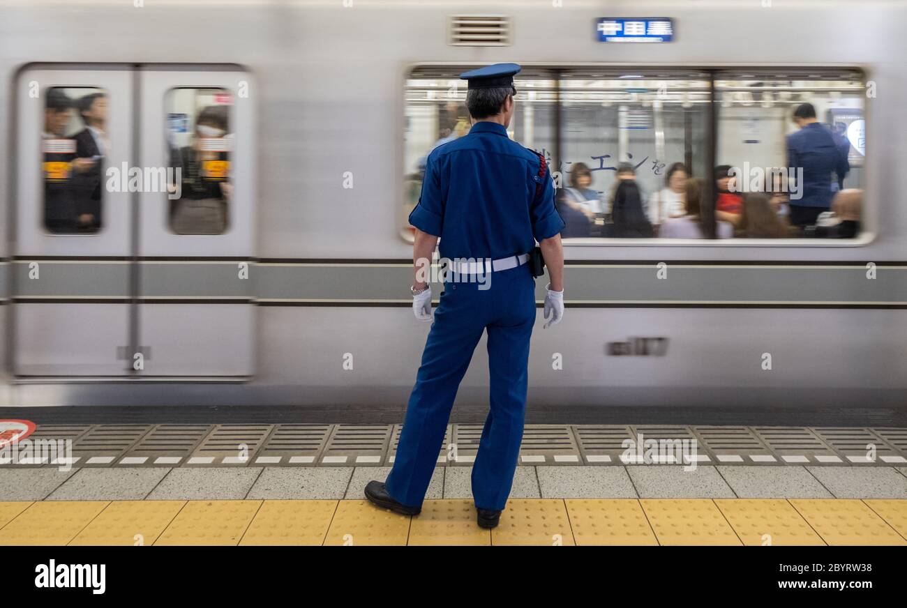 Japanese subway guard hi-res stock photography and images - Alamy