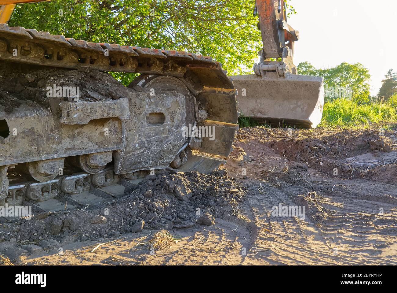 excavator tracks close-up. Construction equipment during road works ...