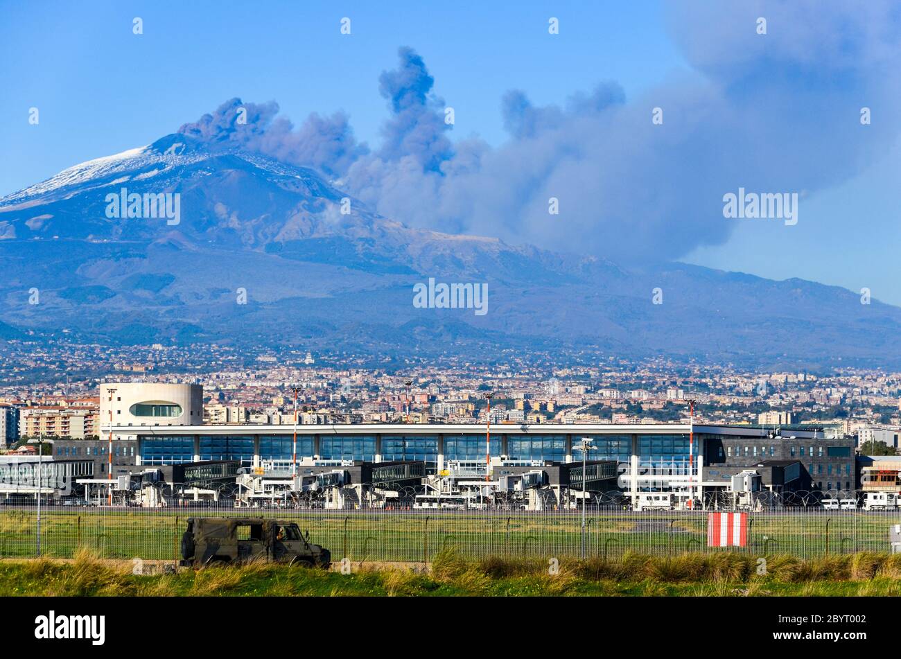 Airport of Catania in front of a live eruption of Mount Etna (Sicily ...