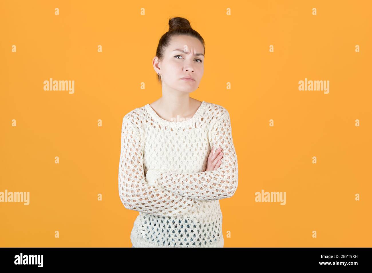 girl folded her arms over her chest and looks condemning Stock Photo ...