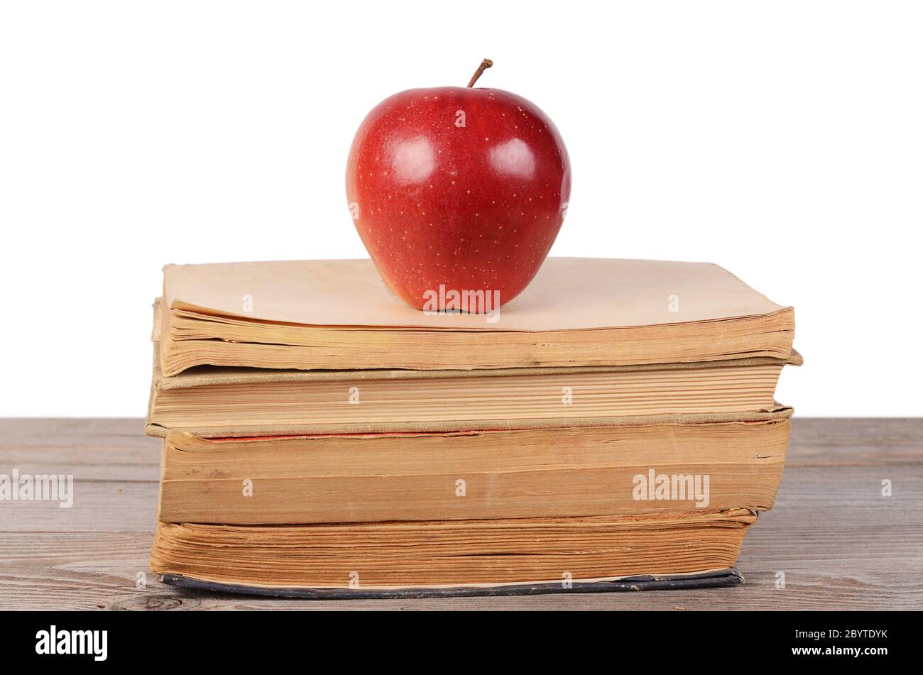 Book with apple isolated on white Stock Photo - Alamy