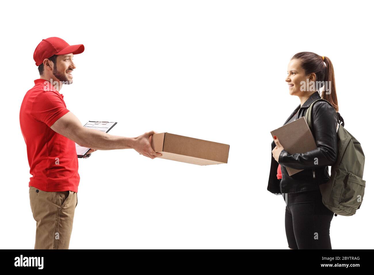 Delivery man handing a package to a female student isolated on white ...