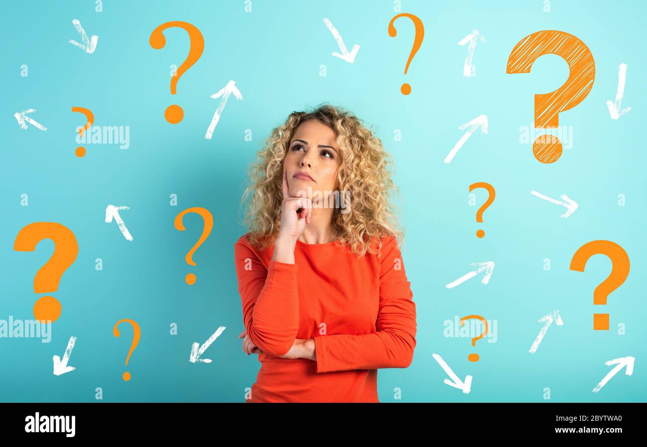Confused and pensive expression of a girl with many questions . cyan ...