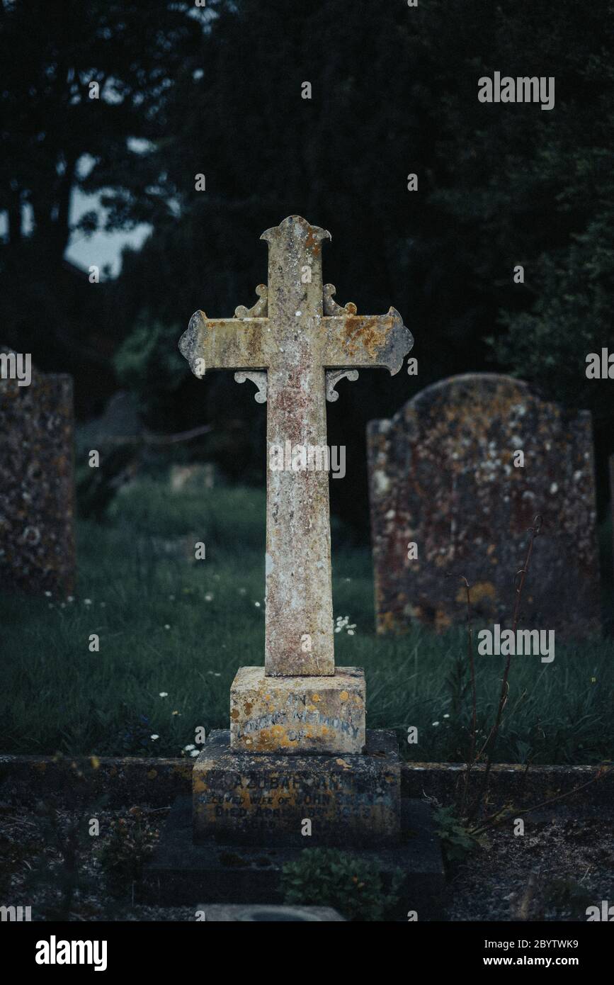 gravestone cross in cemetery graveyard in evening Stock Photo - Alamy