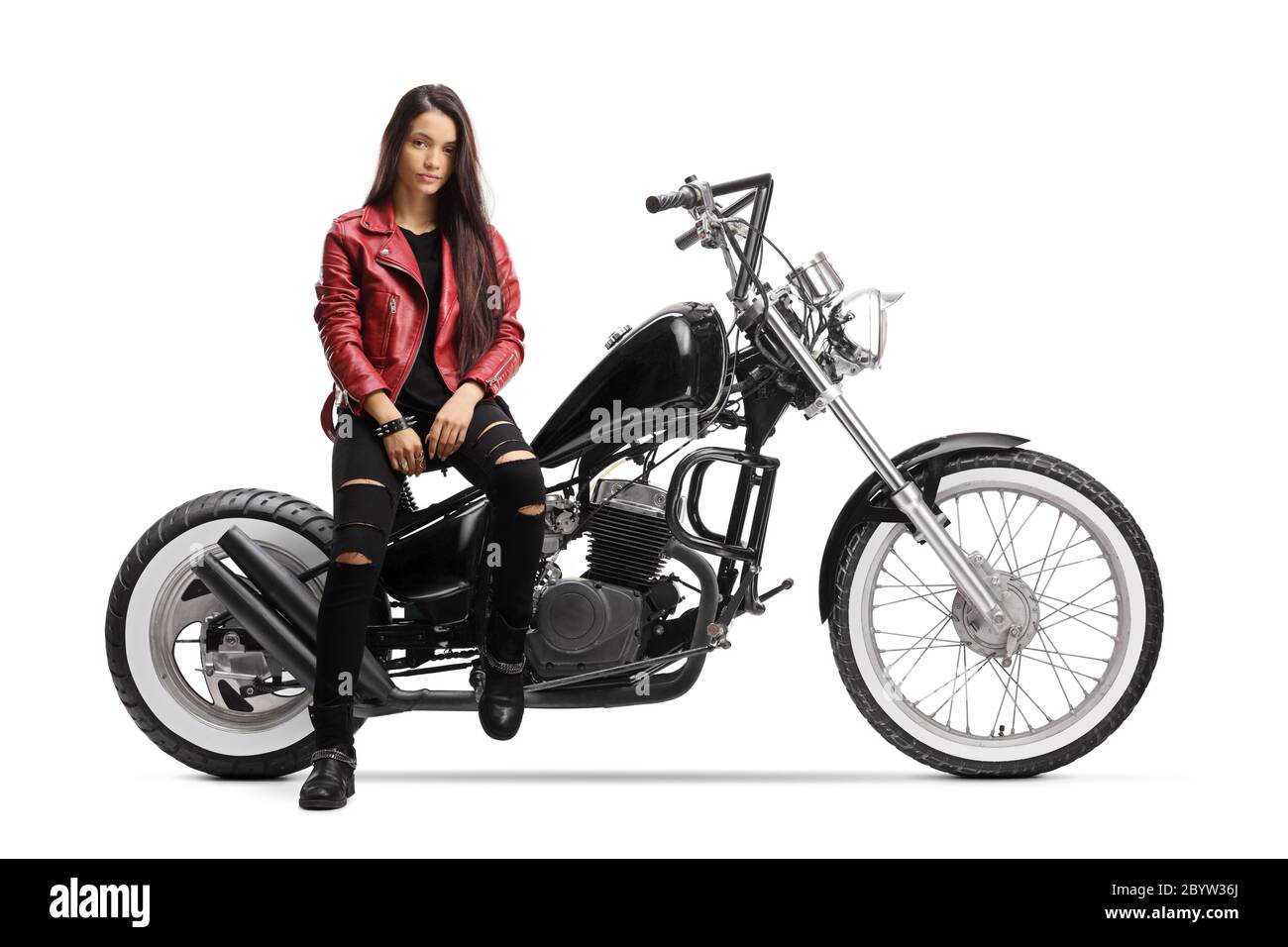 Female biker with a leather jacket sitting and posing on a chopper ...