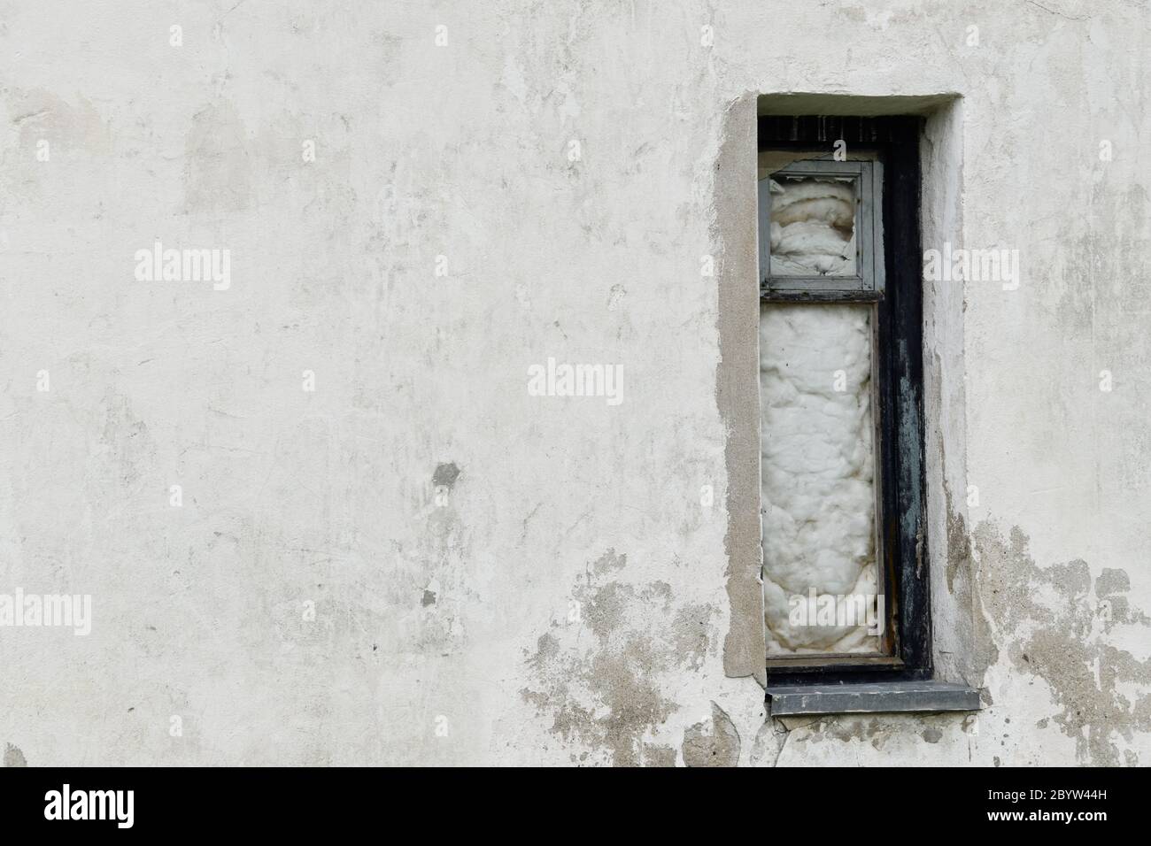 Boarded building window with burnt discolored planks Stock Photo - Alamy