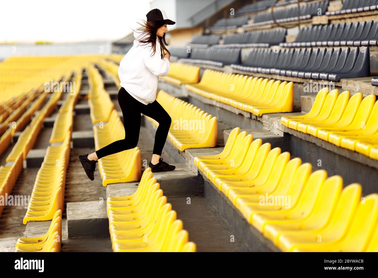 Sporty woman at the stadium on the stairs Stock Photo - Alamy