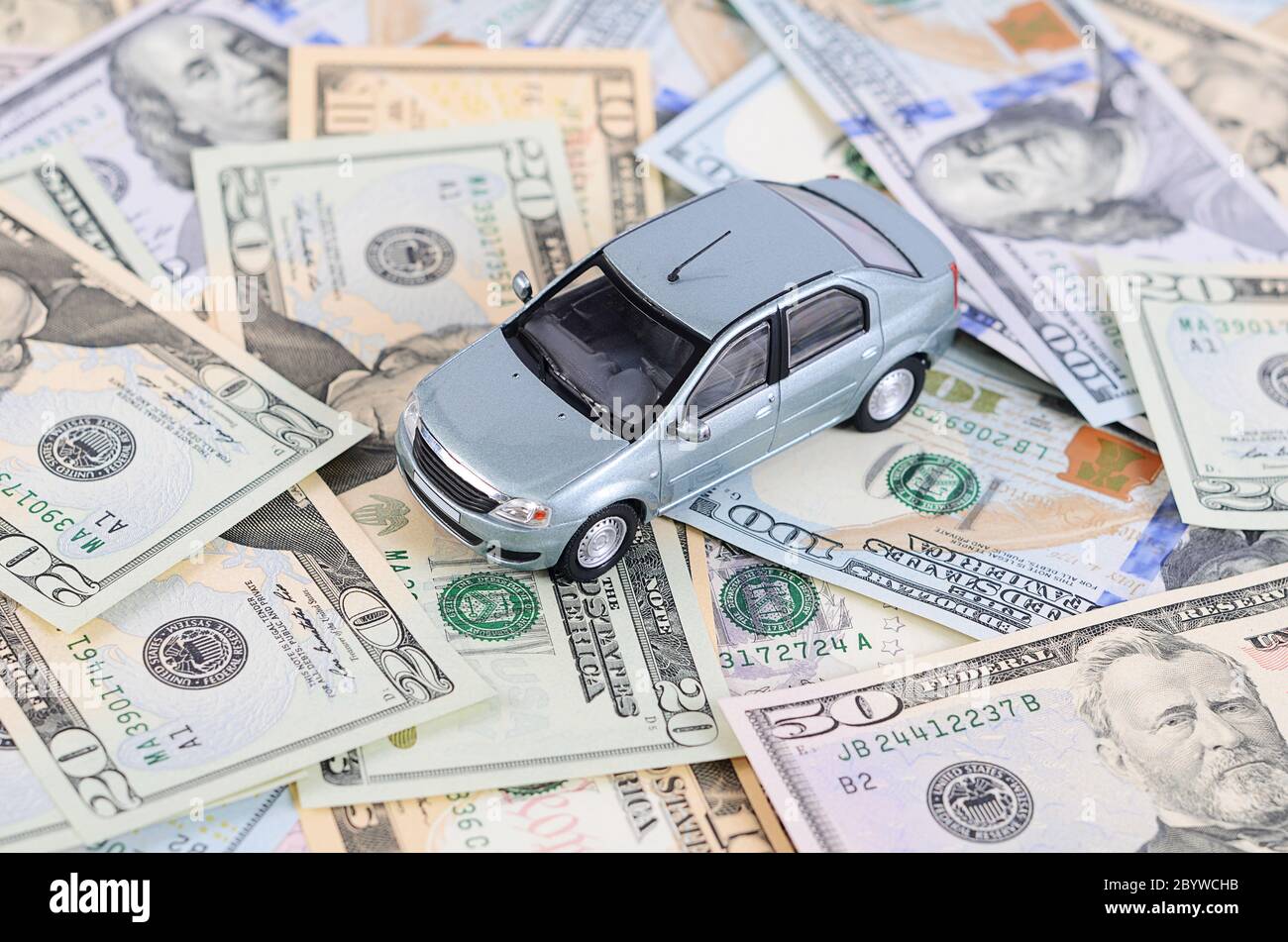 Car model on dollar bills Stock Photo - Alamy