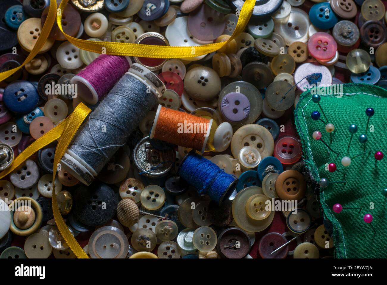 A group of old threads and buttons in a textile workshop Stock Photo ...