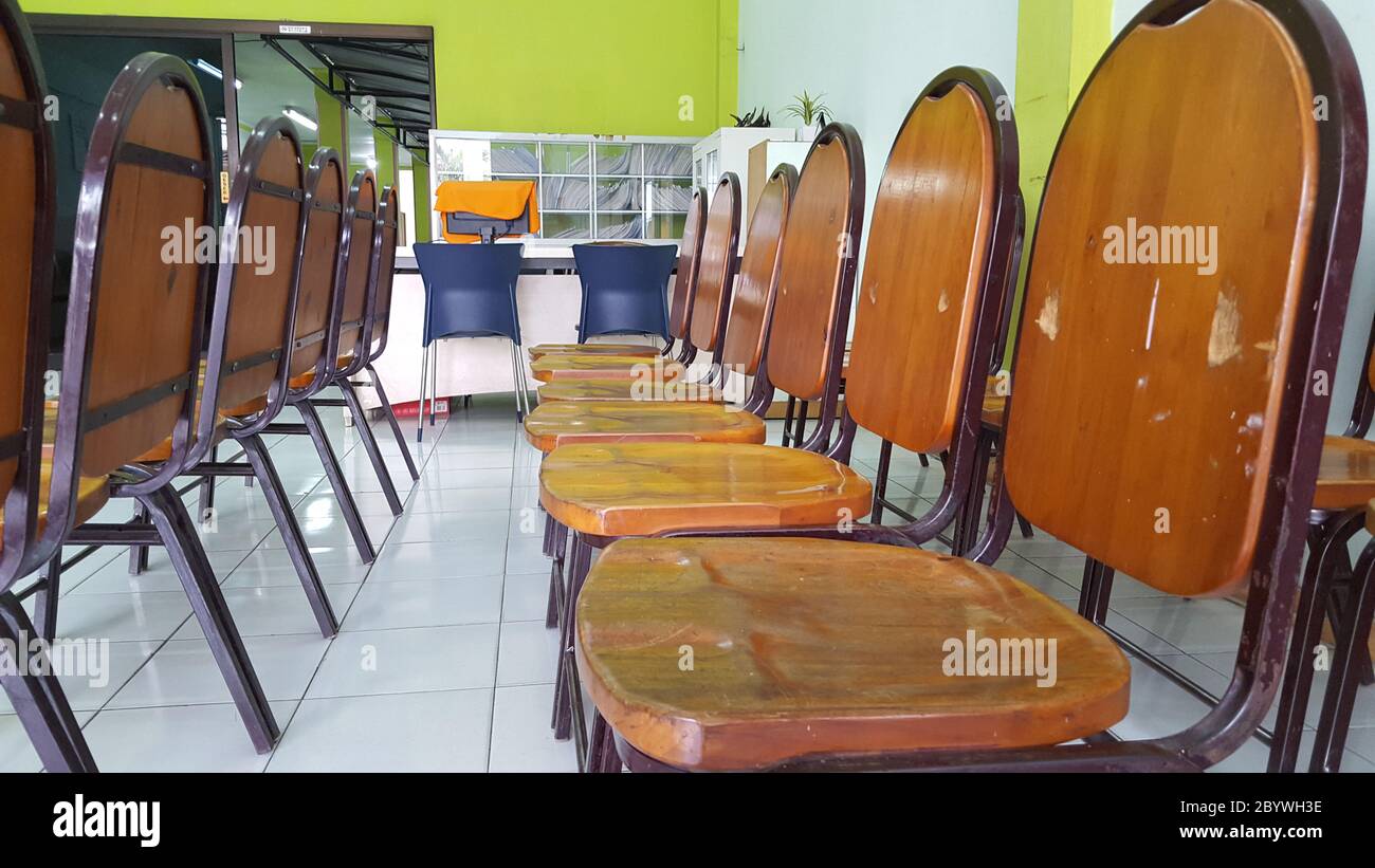Rows of queue chairs at a health clinic, where patients sit their turn ...