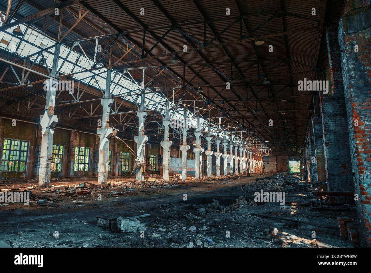 Dirty abandoned ruined industrial building inside, toned Stock Photo ...