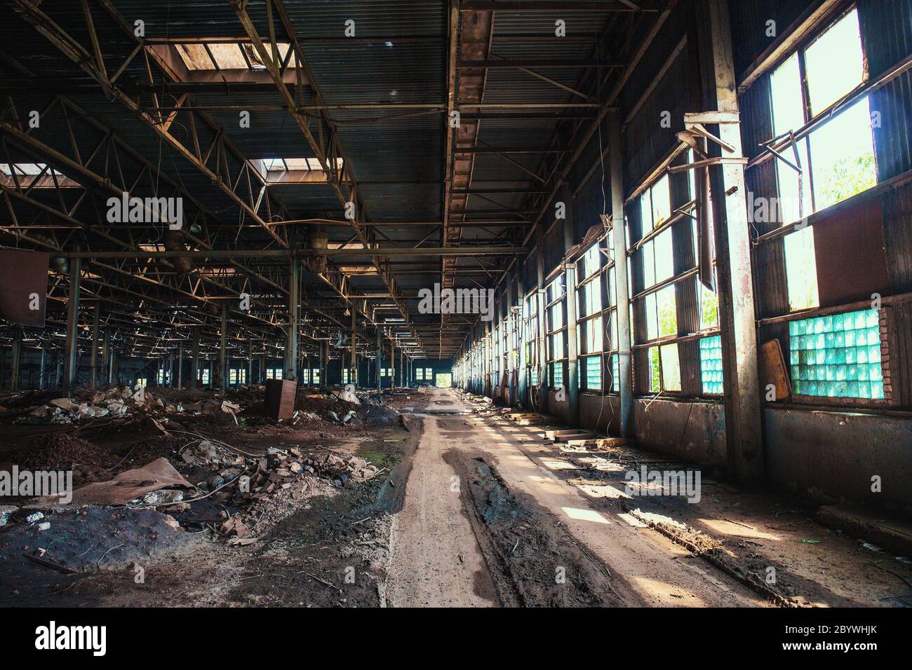 Dirty abandoned ruined industrial building inside, toned Stock Photo ...