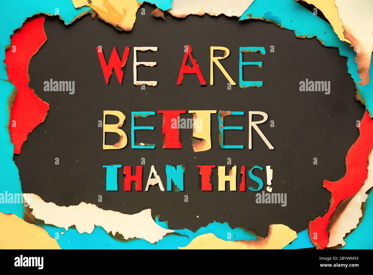 Paper hole with burned edges, flat lay on paper, colorful paper text We ...
