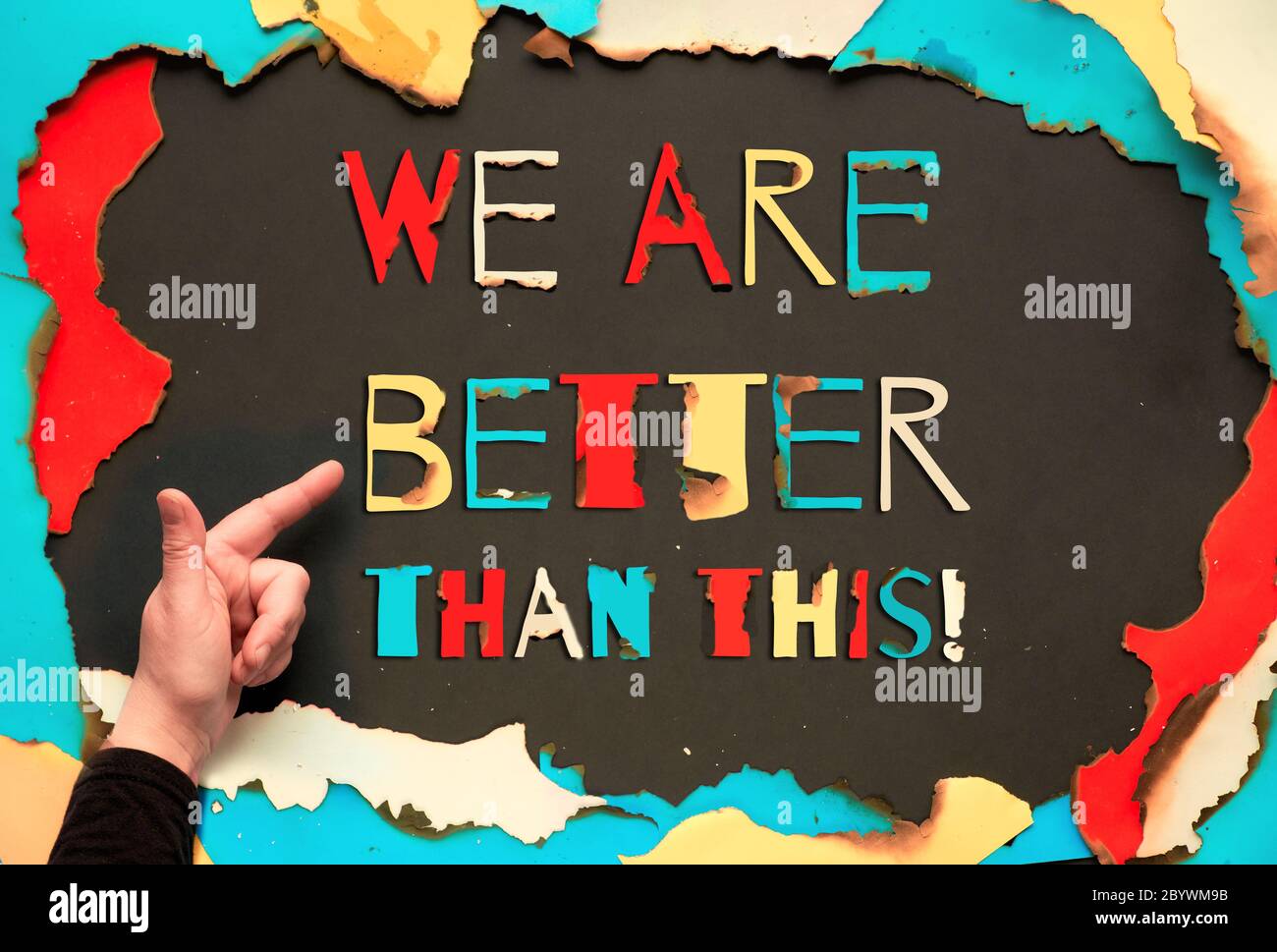 Paper hole with burned edges, flat lay on paper, colorful paper text We ...