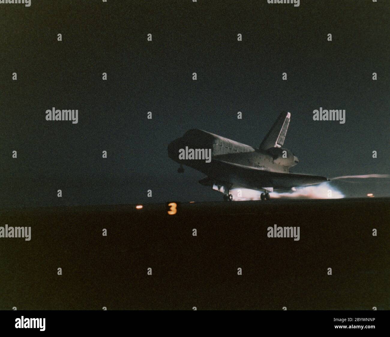 (21 Feb 1997) --- The Space Shuttle Discovery partially lights up the ...