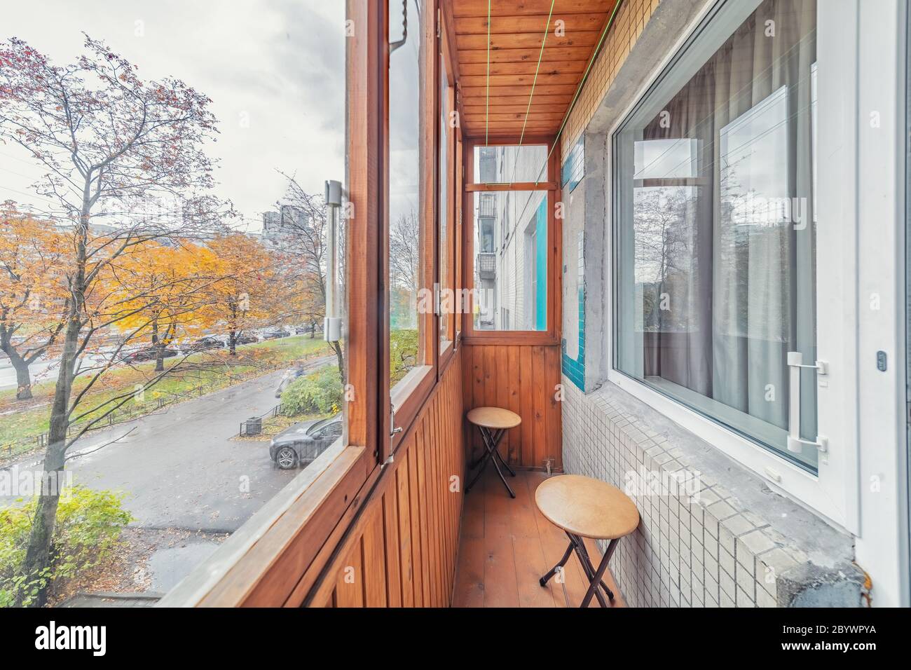 Small old common open balcony interior in high residential apartment ...