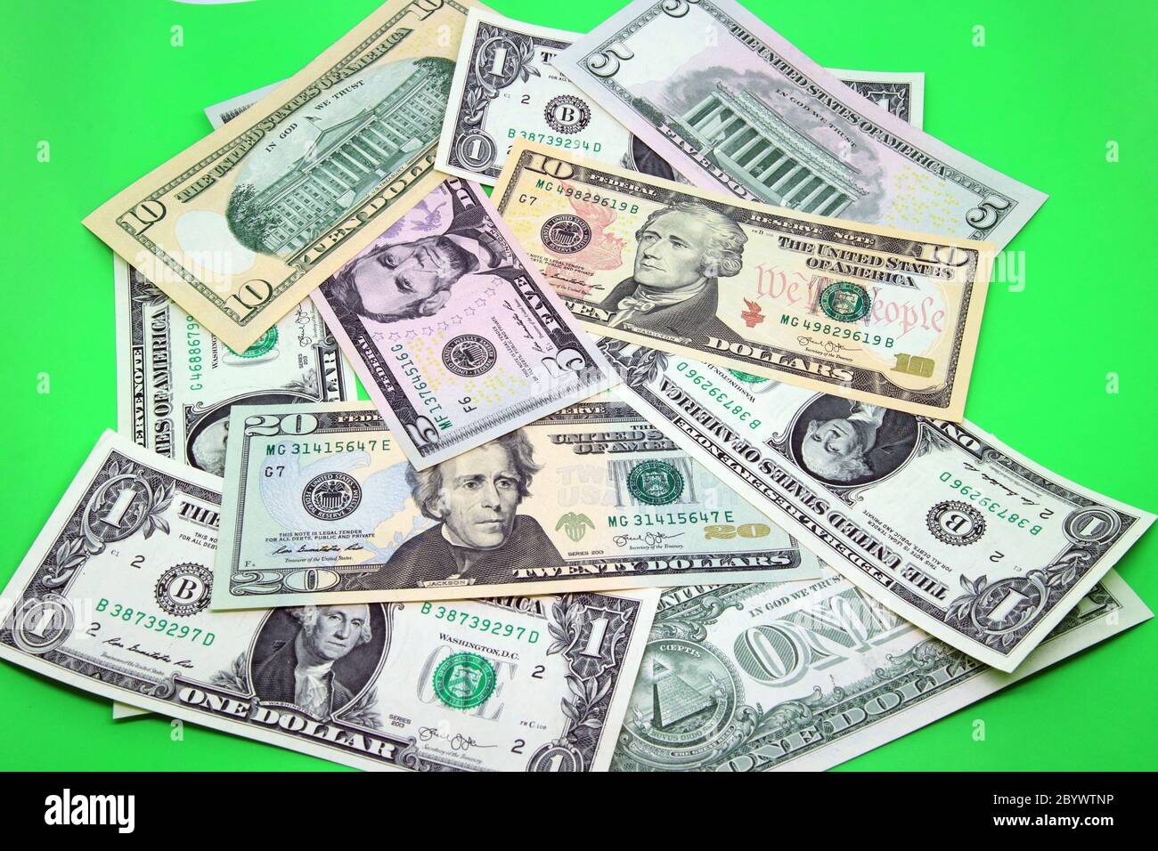 American dollars bills in denominations of 1, 5, 10 and 20 scattered ...