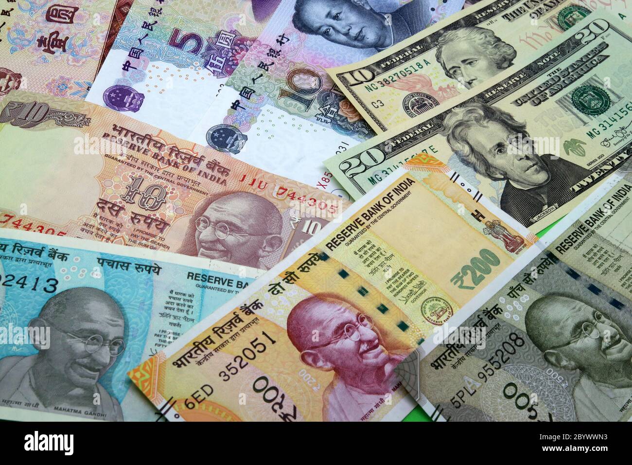 Mix of American, Chinese and Indian colorful banknotes close up Stock ...