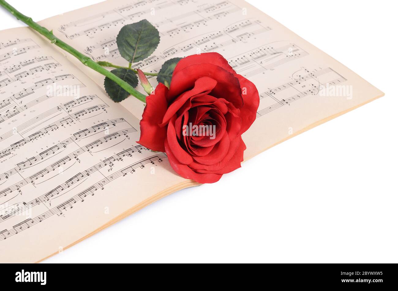 Red rose on sheet of music hi-res stock photography and images - Alamy