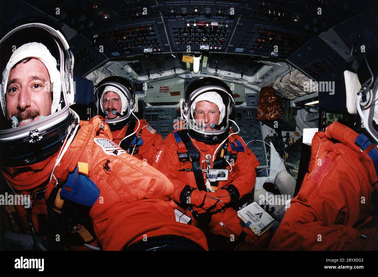 STS-82 crew members participate in a practice launch countdown inside ...