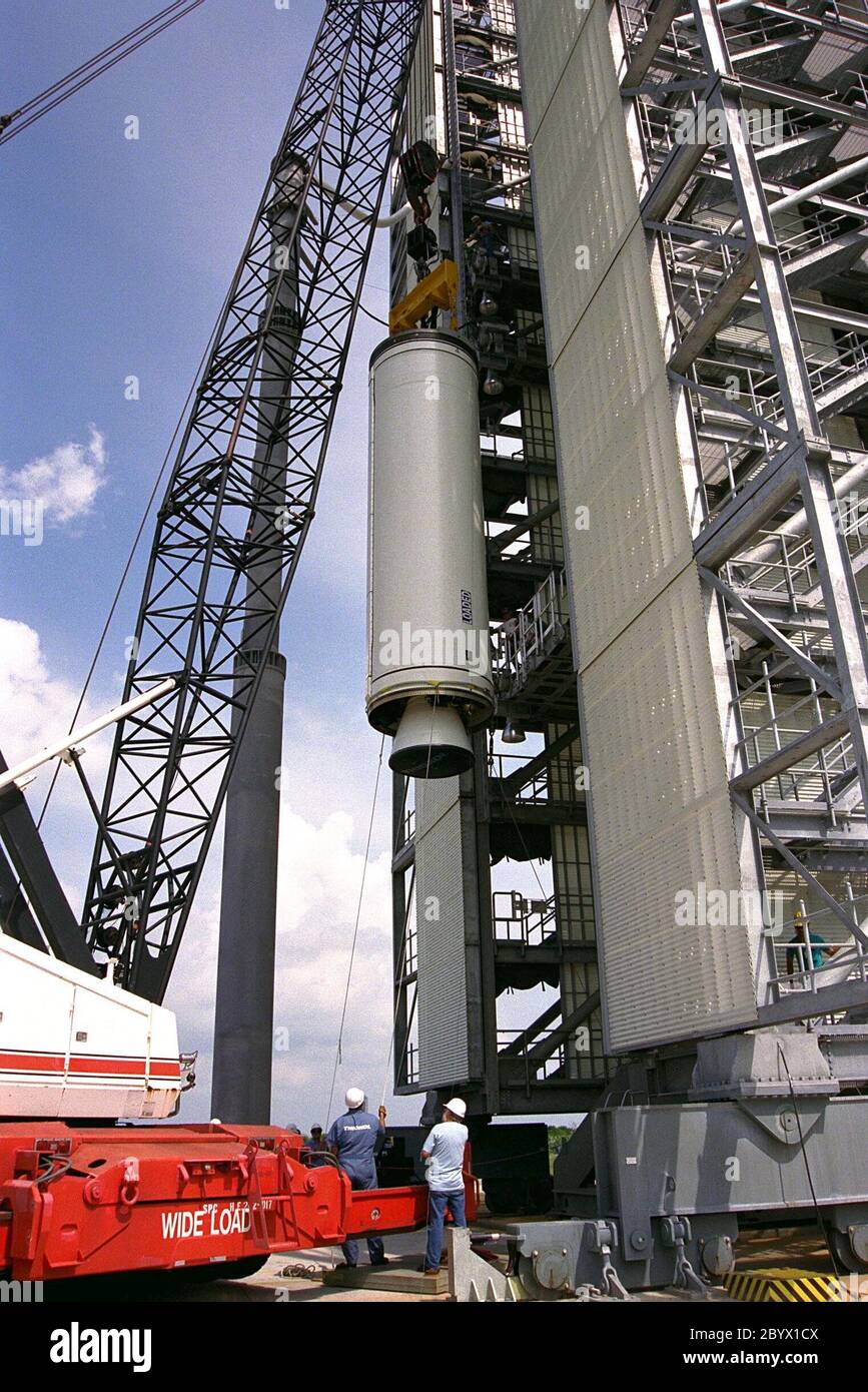 Workers erect the first stage of a Lockheed Martin Launch Vehicle-2 ...