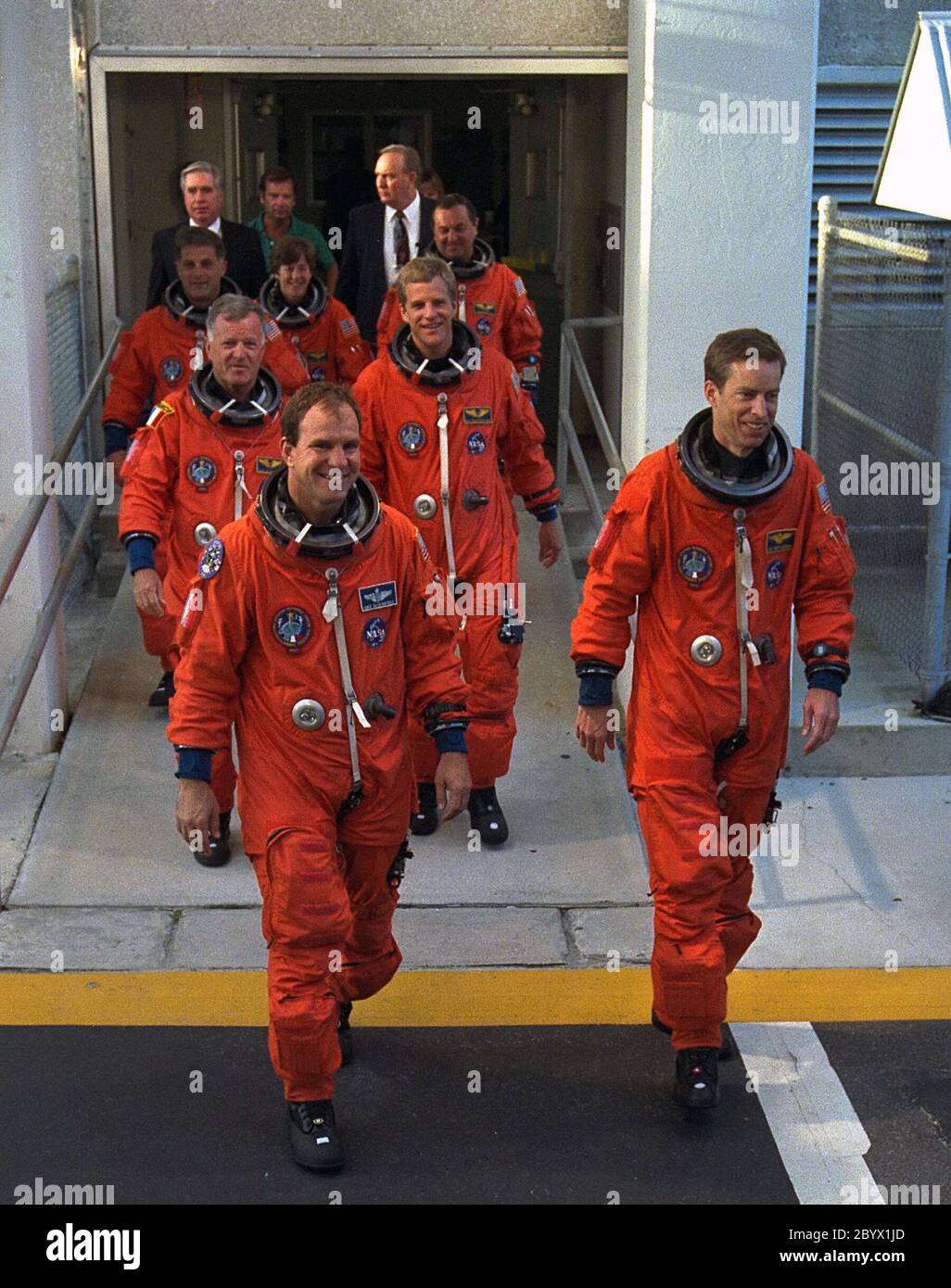 STS-86 Commander James D. Wetherbee, in foreground at right, leads the ...